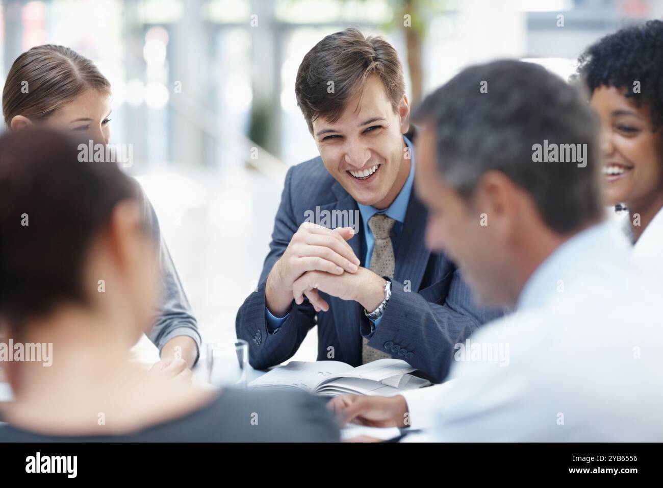 Funny, group and business people in meeting, planning and communication ...