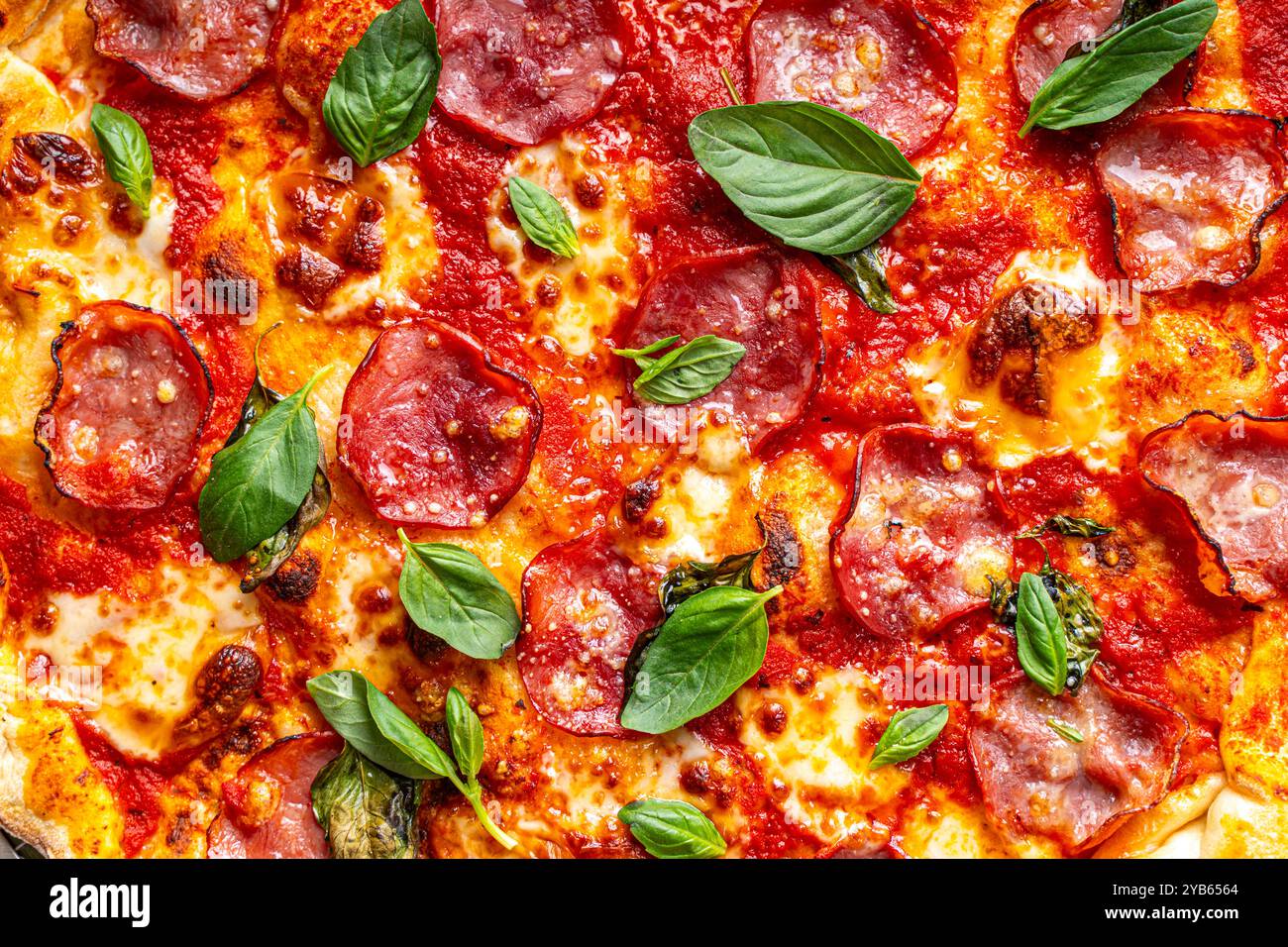 Close-up pepperoni pizza with basil. Pizza textured background. Use for ...