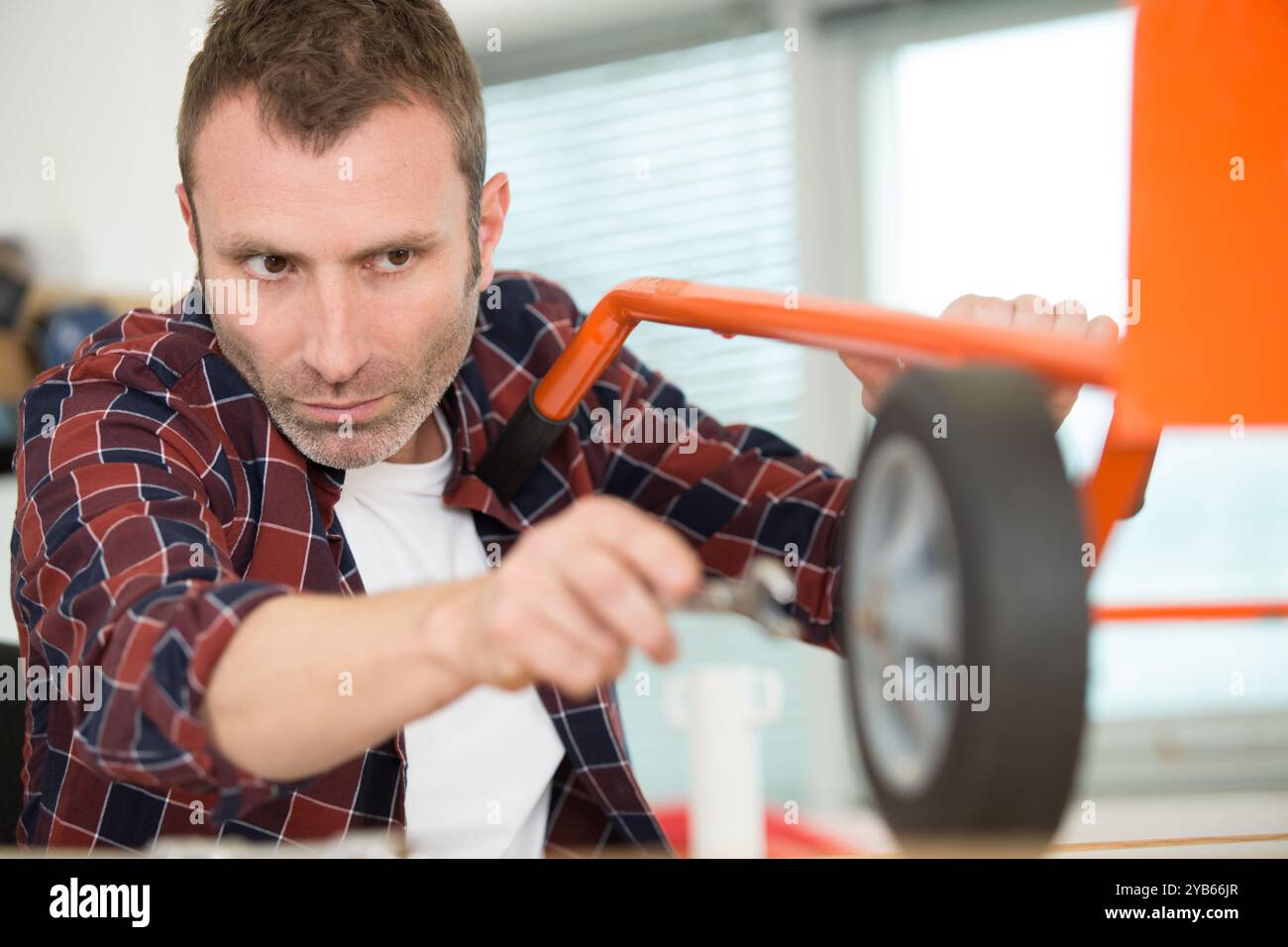 man working trolley wheels Stock Photo - Alamy