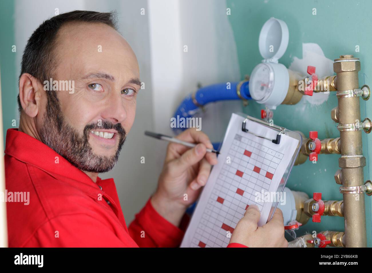 technician reading the water meter to check consumption Stock Photo - Alamy