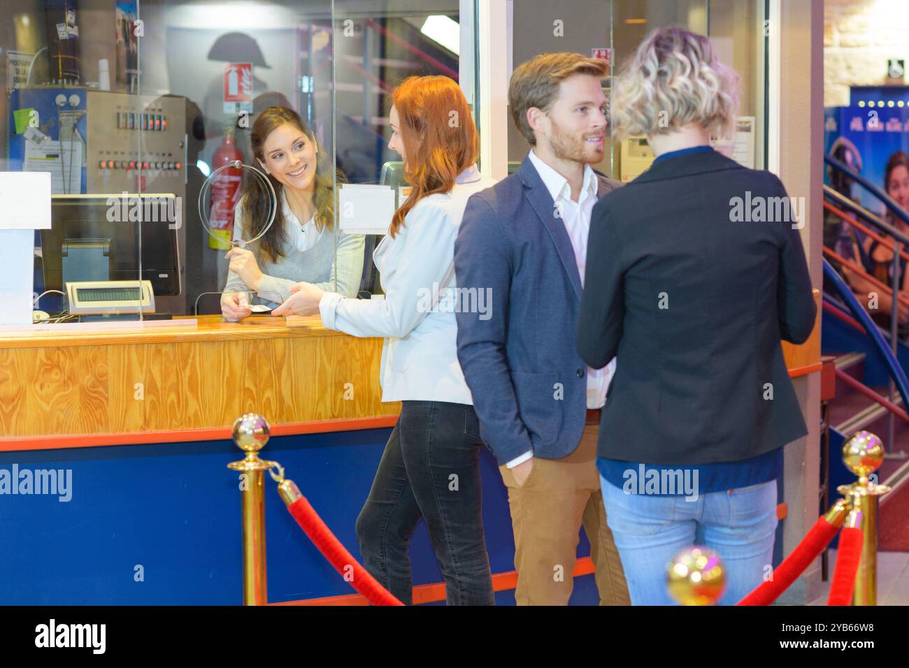 crowd of people buying ticket to cinema in shopping mall Stock Photo ...