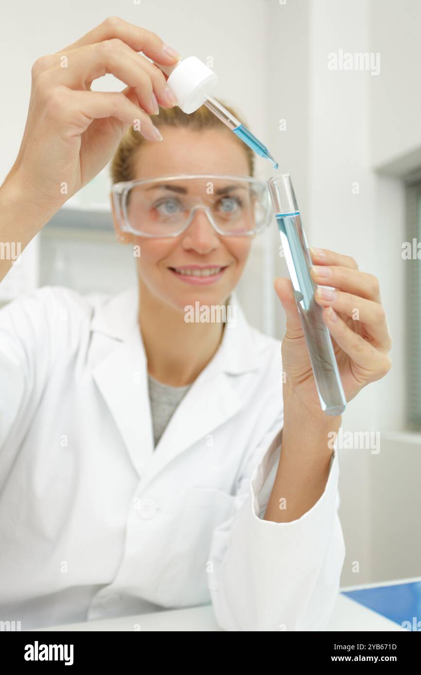 woman doing experiments in a lab Stock Photo - Alamy