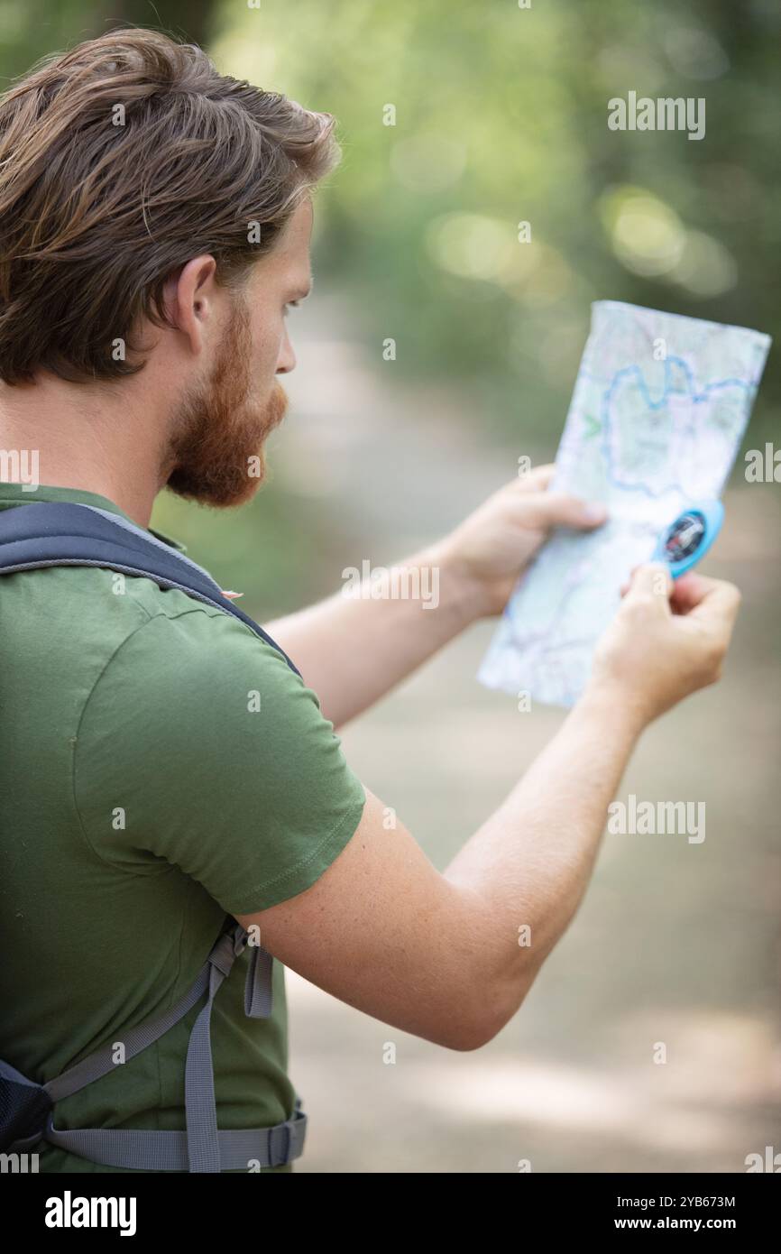 Hiker navigating map compass hi-res stock photography and images - Alamy
