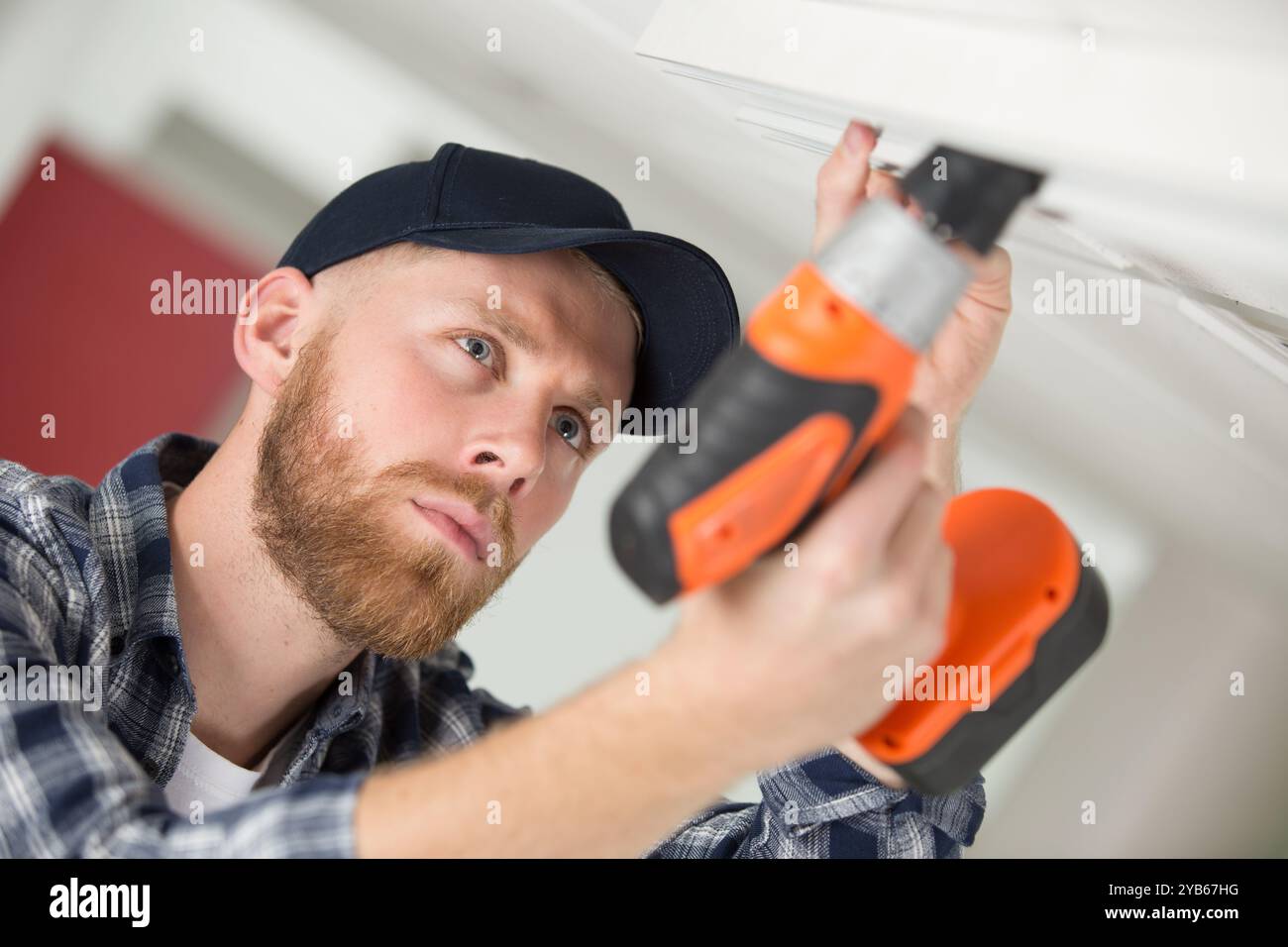 Manual worker drilling ceiling hi-res stock photography and images - Alamy