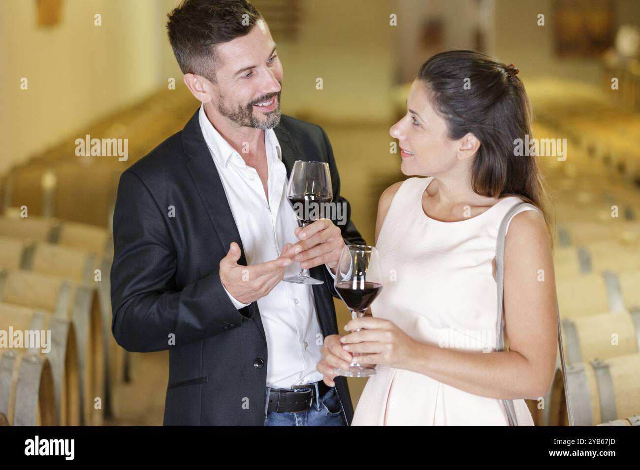 people tasting wine in cellar Stock Photo - Alamy