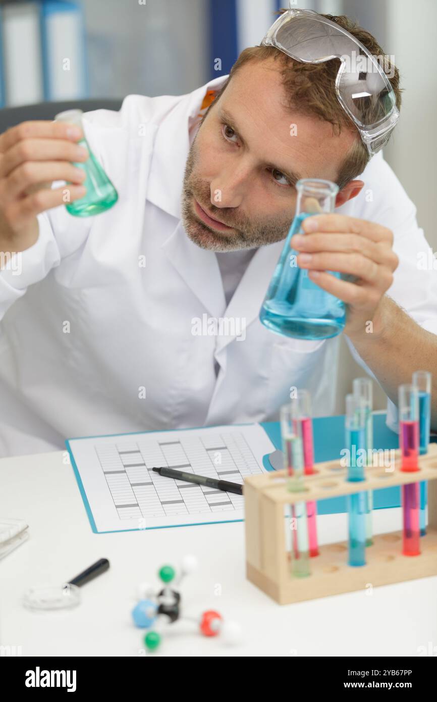 concentrated lab worker making an experiment Stock Photo - Alamy
