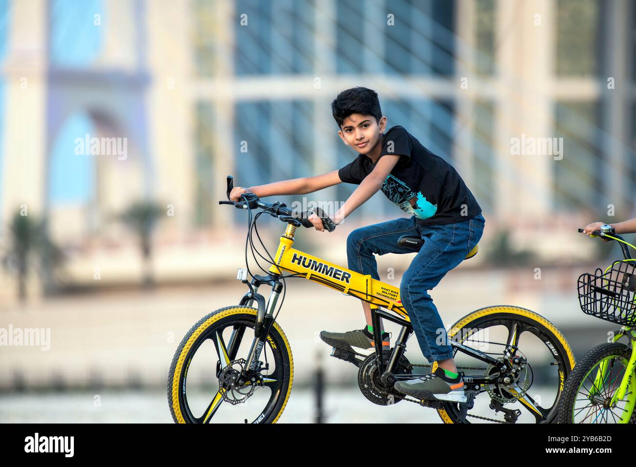 Boy ride his bicycle on Qatar Sports Day Stock Photo - Alamy