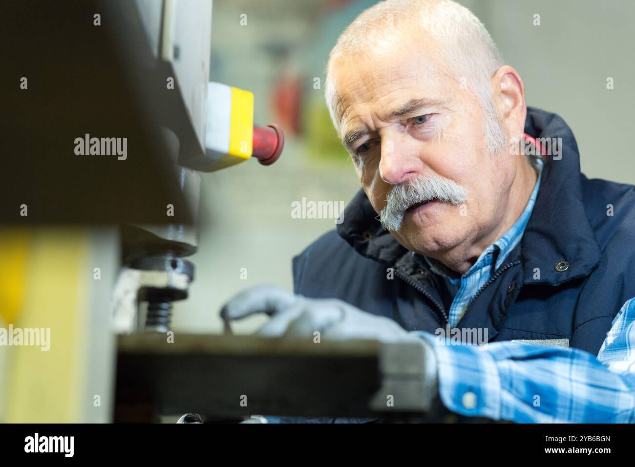 male driver operating modern tractor in livestock farm Stock Photo - Alamy