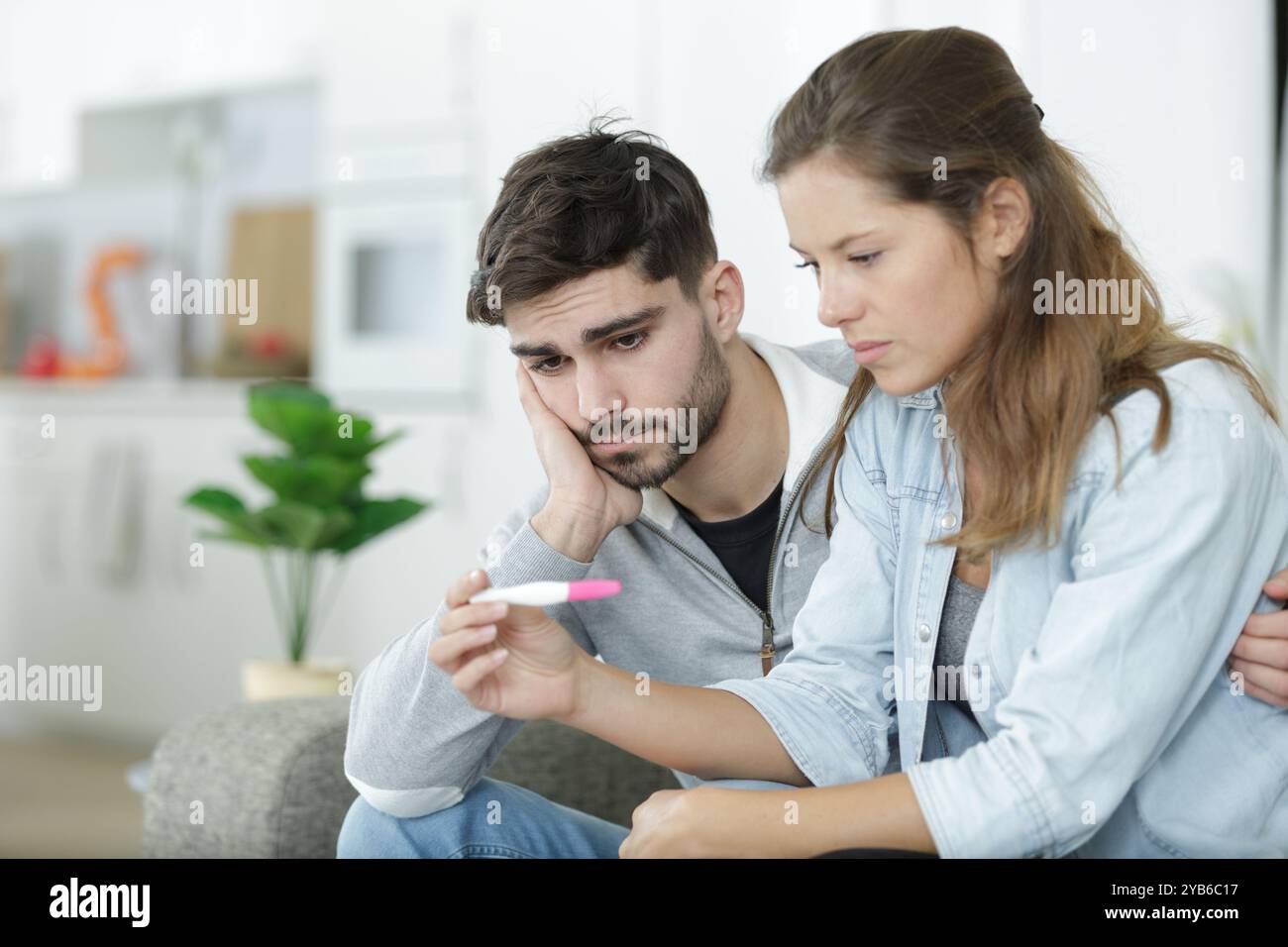 sad couple after negative pregnancy test result Stock Photo - Alamy