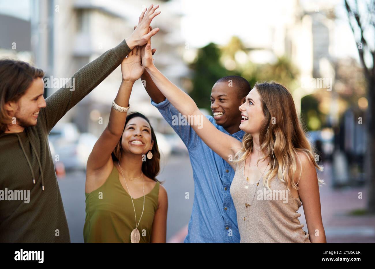 Happy people, friends and city with hands together for motivation ...