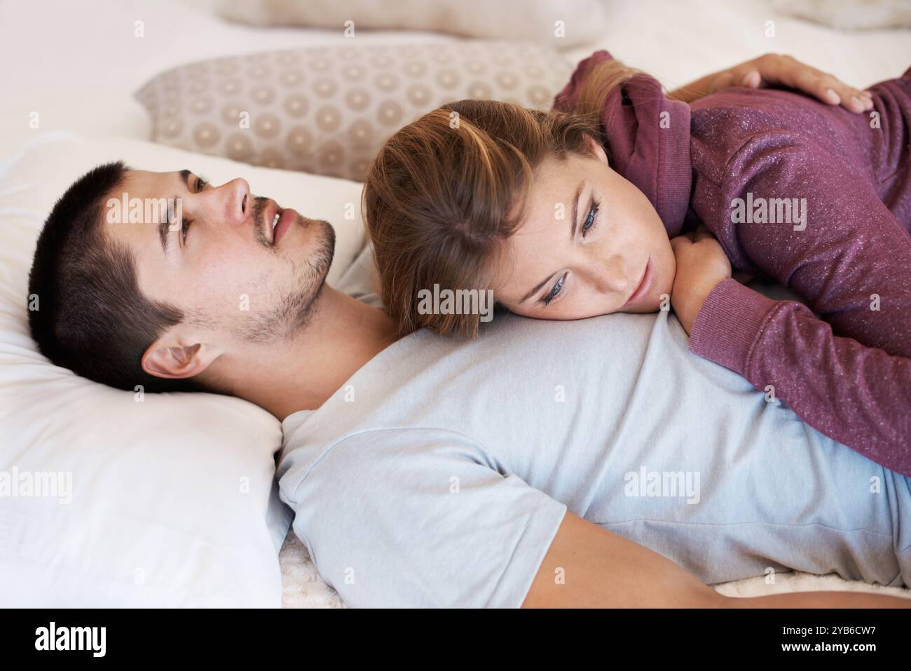 Love, cuddle and relax with couple in bedroom for romance, valentines day and marriage ...