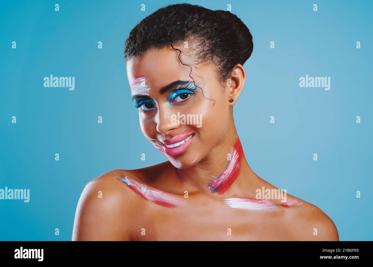 Studio, portrait and woman with face paint, creative and color of ...