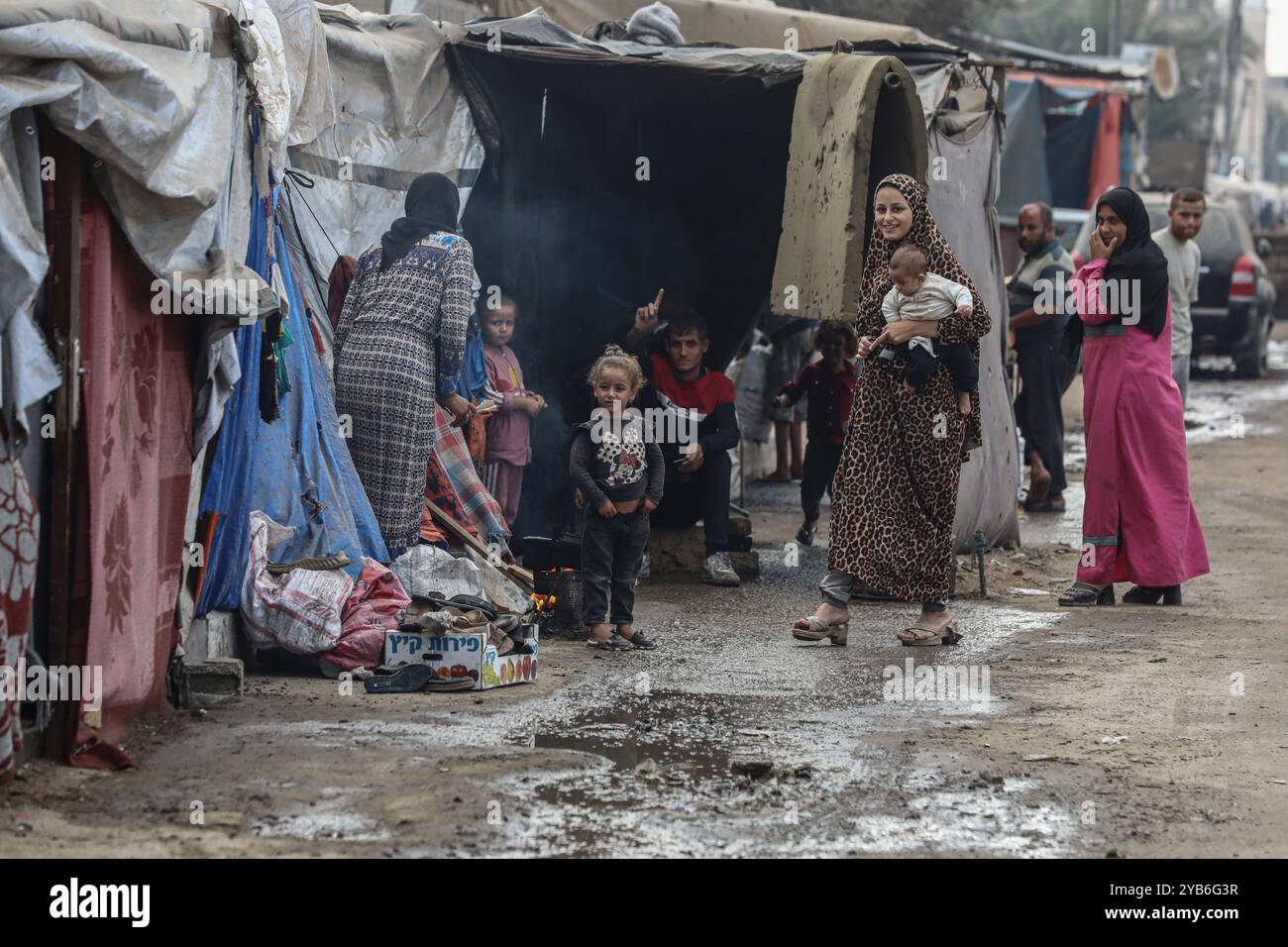 Displaced Palestinian children are seen at a temporary shelter in the ...