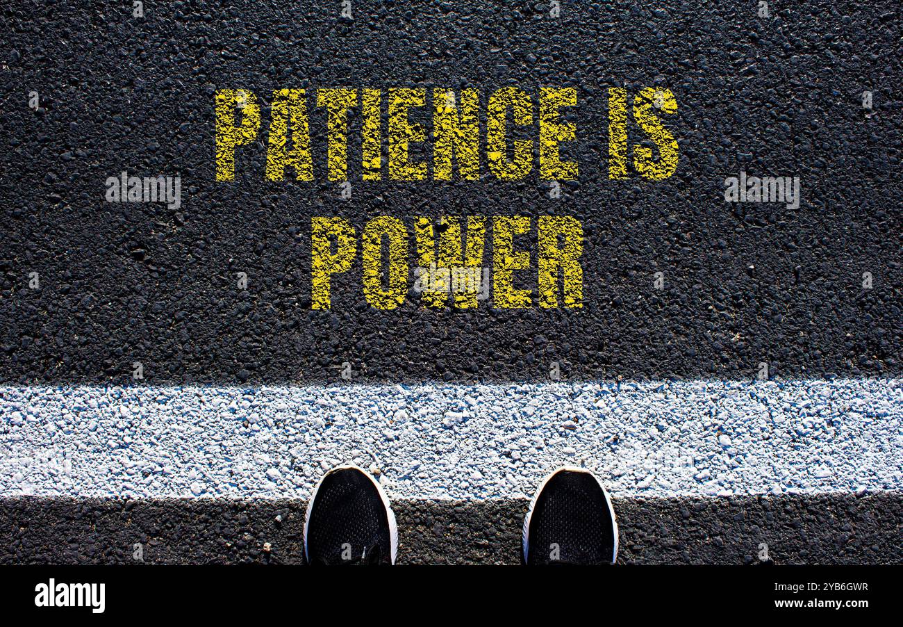 Patience is power message written on asphalt road. Conceptual patience ...
