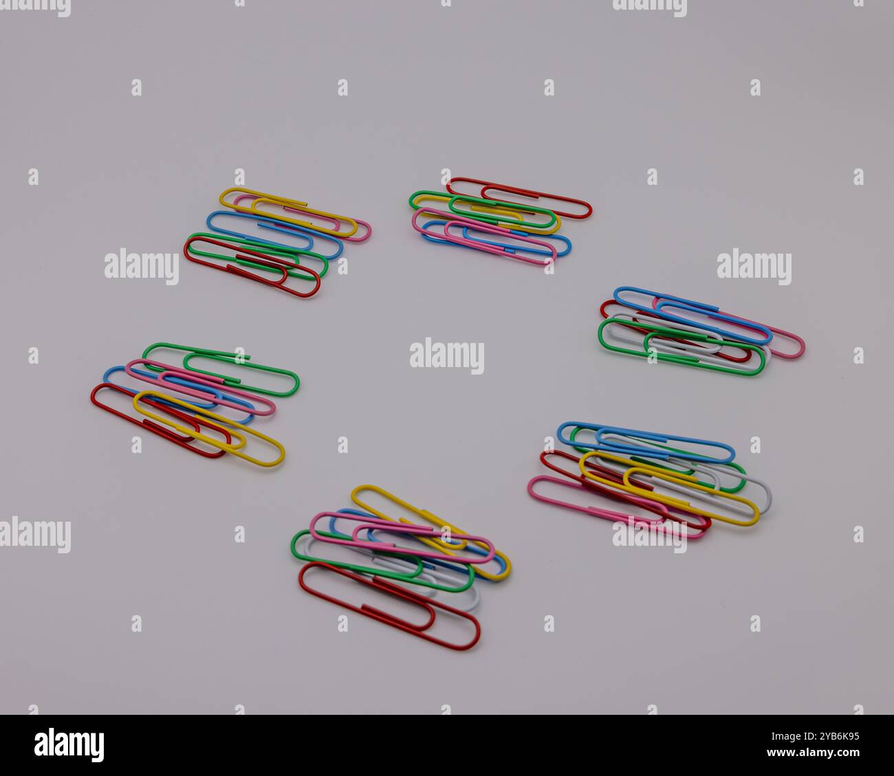 The colorful paper clips arranged in a circular pattern Stock Photo - Alamy