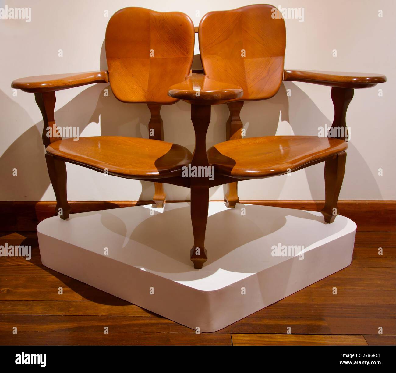 Wooden Confidant double sofa designed for the Batlló House on display ...