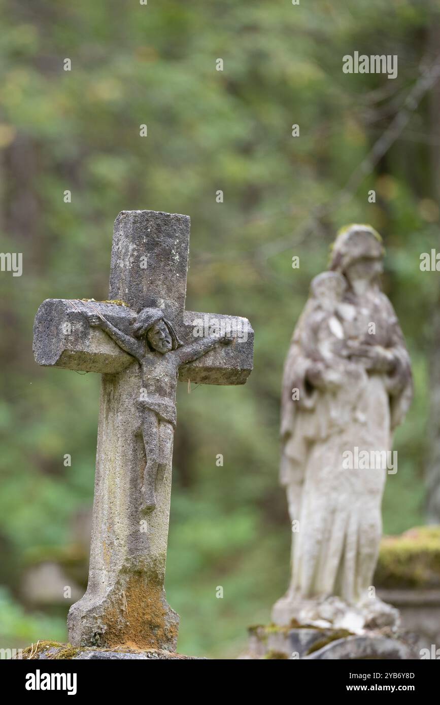 old white crosses and tombstones in a rundown forgotten cemetery in ...