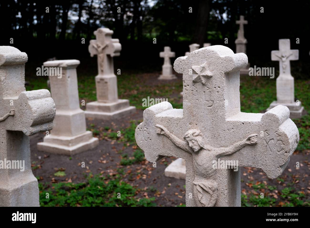 old white crosses and tombstones in a rundown forgotten cemetery in ...