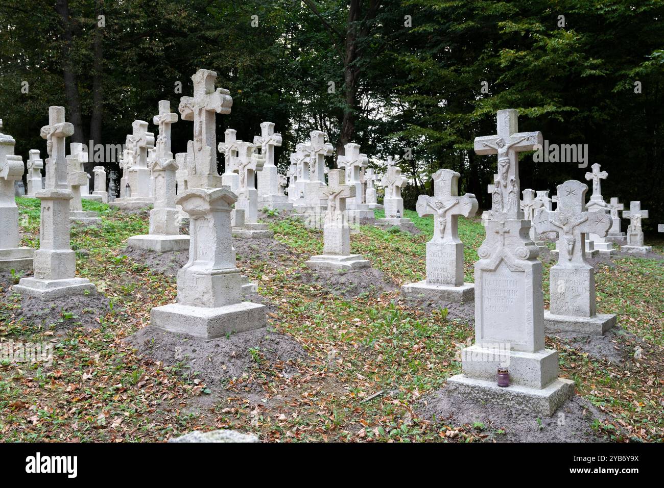 old white crosses and tombstones in a rundown forgotten cemetery in ...