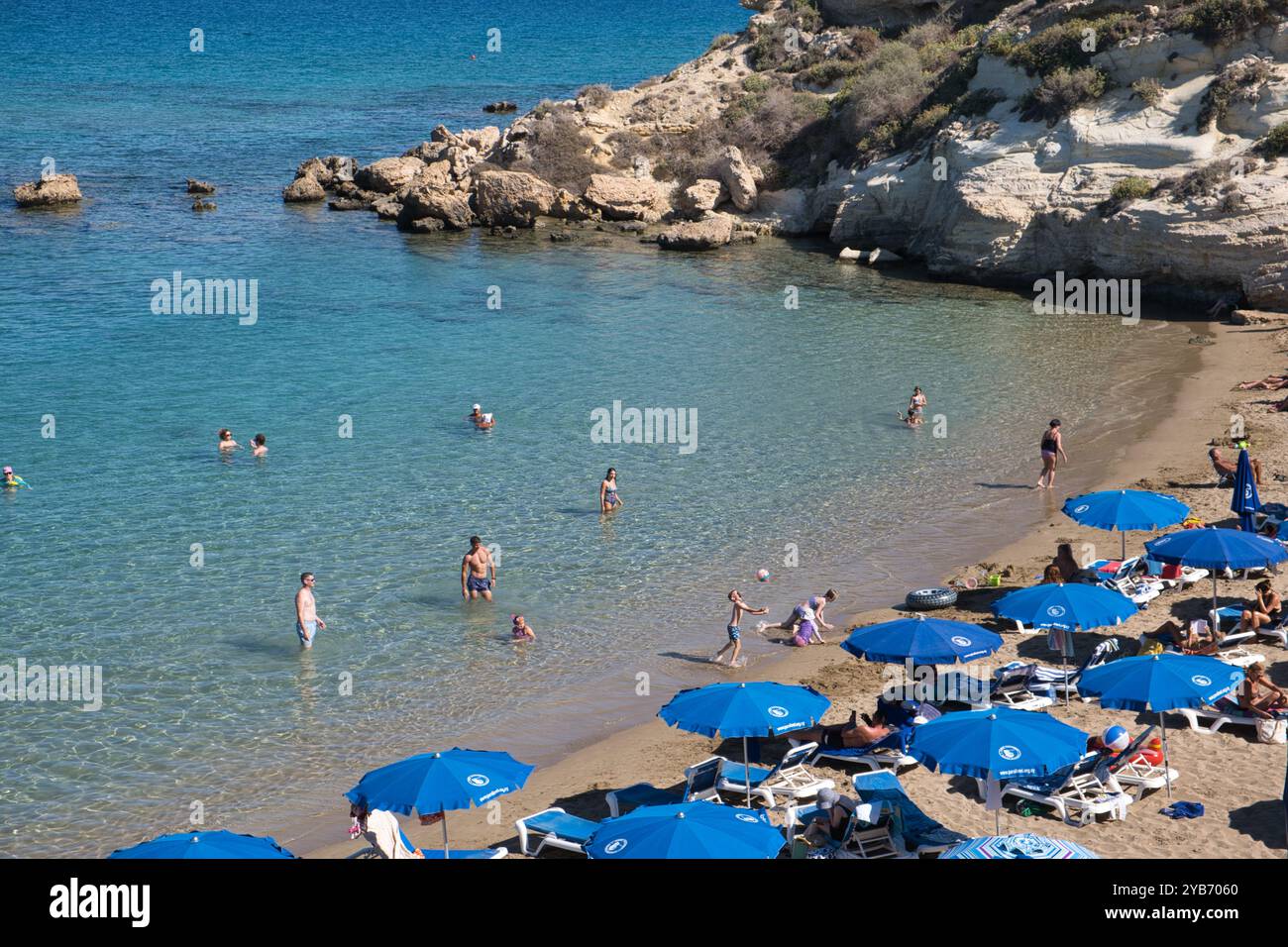 sunbathers enjoying the clear waters of Kapparis beach in Cyprus Stock ...