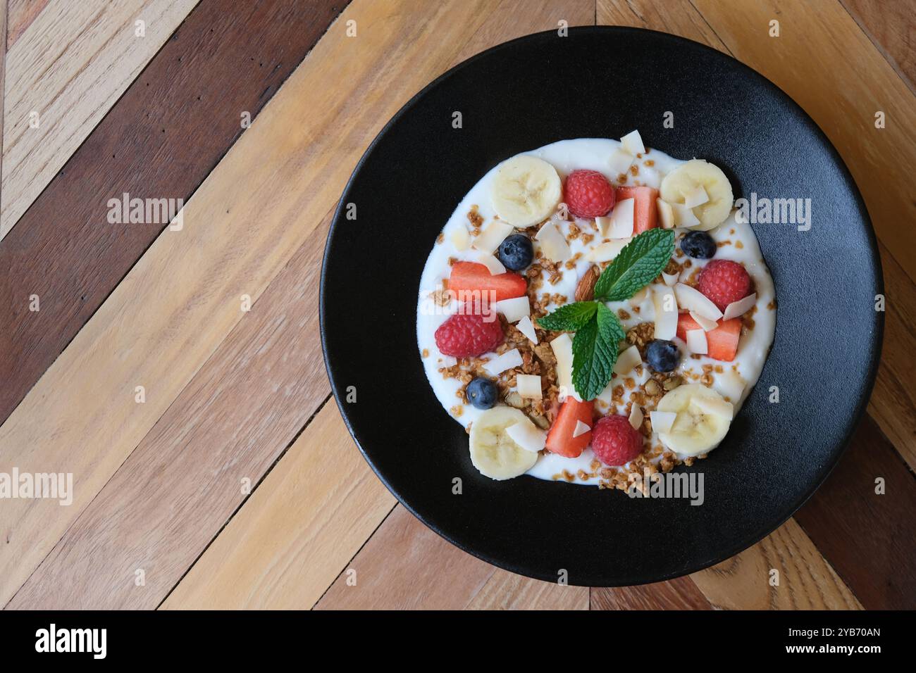 top down view of fruit yogurt on wooden table. Healthy food Stock Photo ...