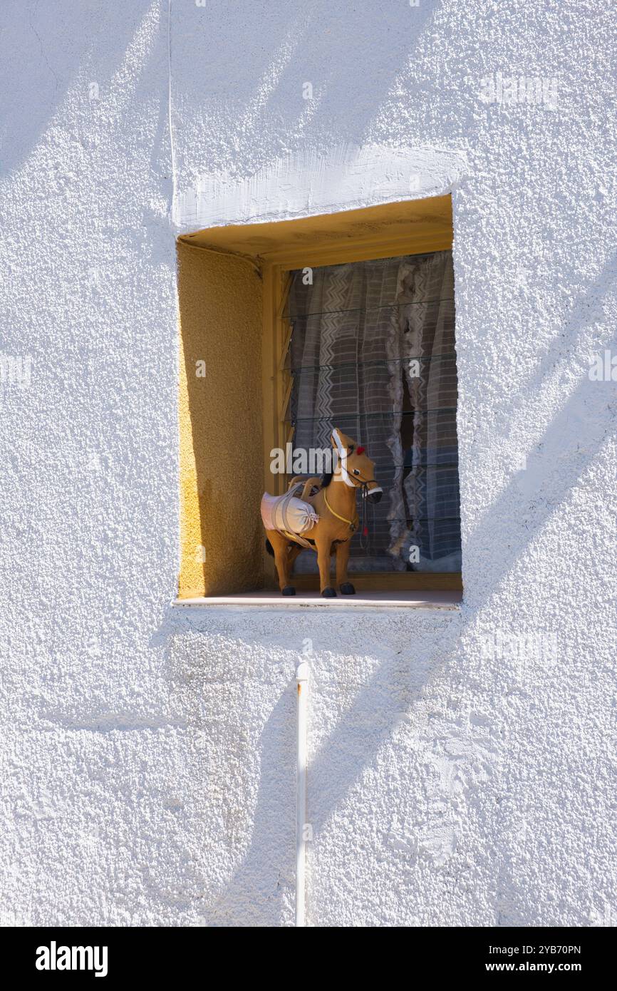 Stuffed toy donkey in window in larnaca, cyprus Stock Photo - Alamy