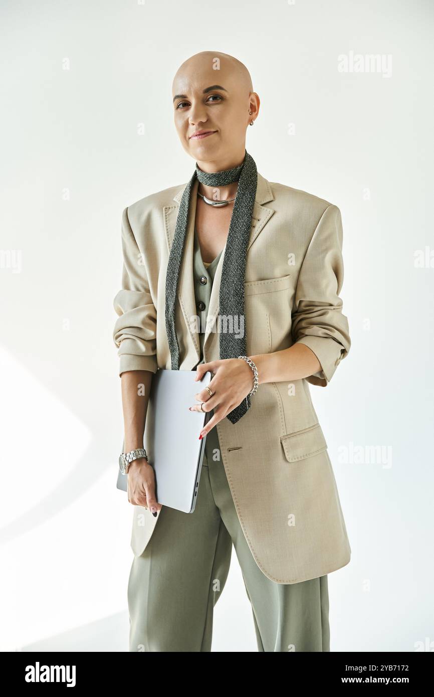 A young bald woman confidently poses in a tailored suit, radiating ...