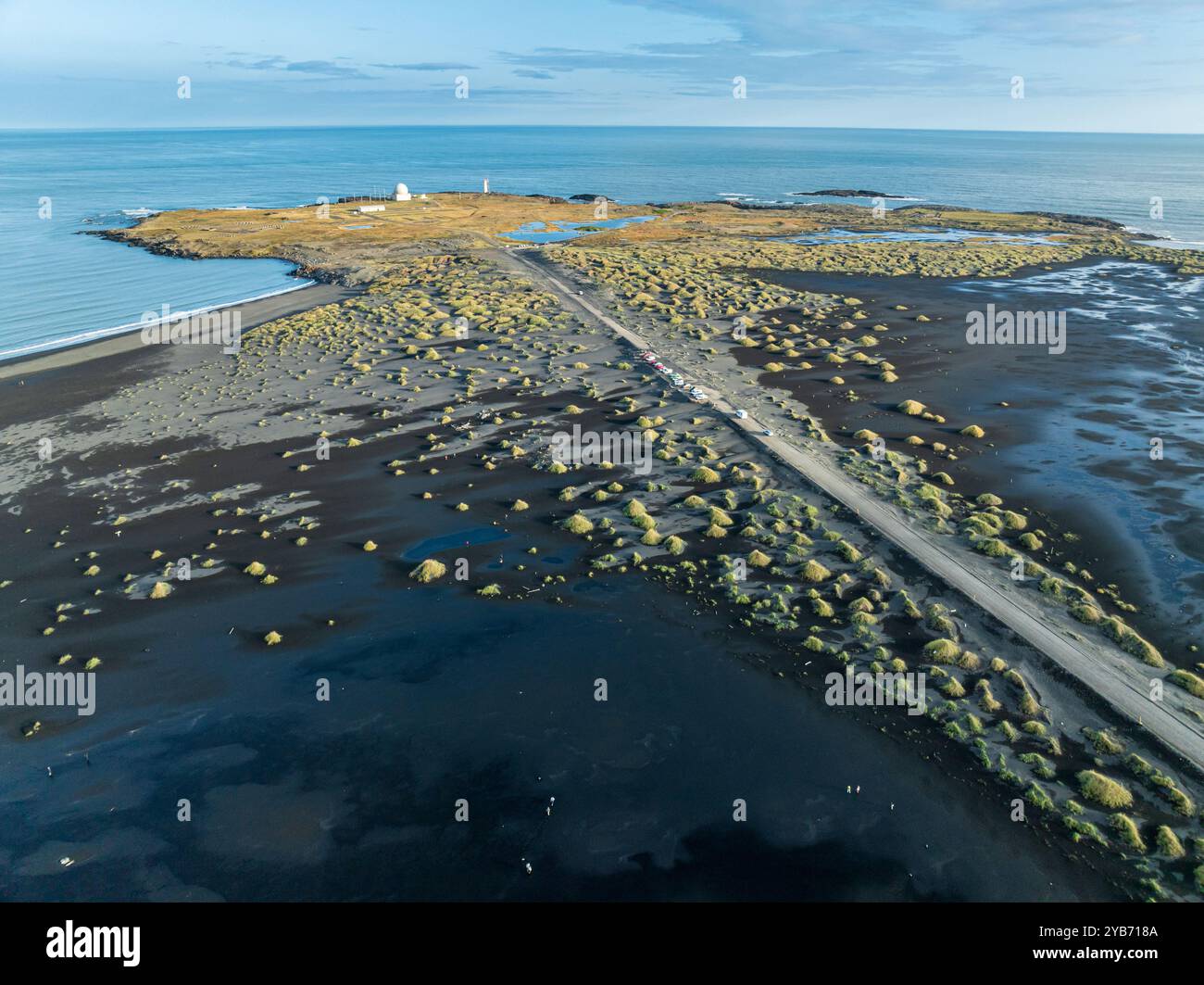 Aerial view of black lava beach, lighthouse and NATO radar station ...