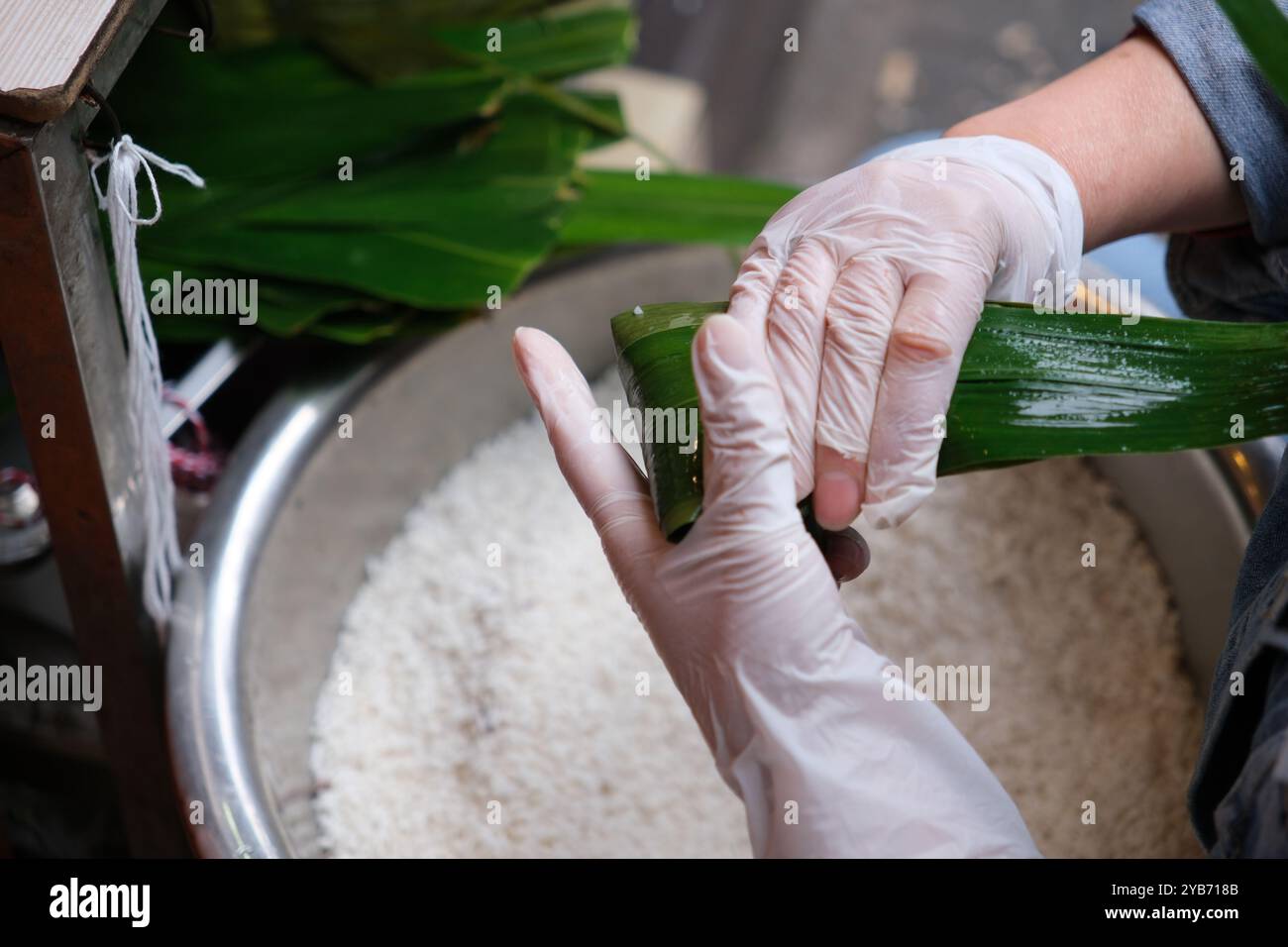 making Zongzi (rice dumpling or sticky rice dumpling). traditional ...