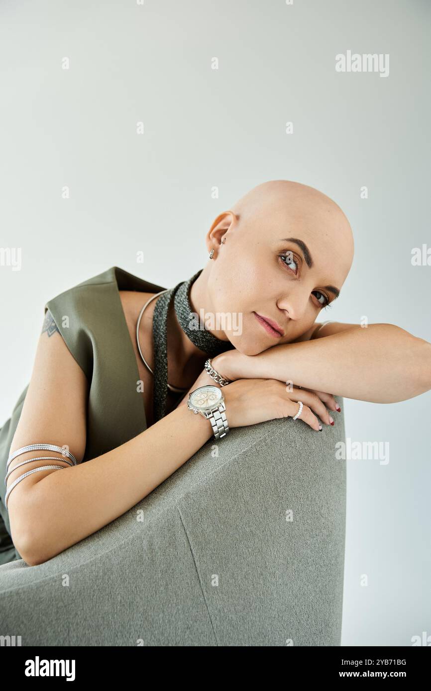 A young bald woman with alopecia poses gracefully, showcasing her ...