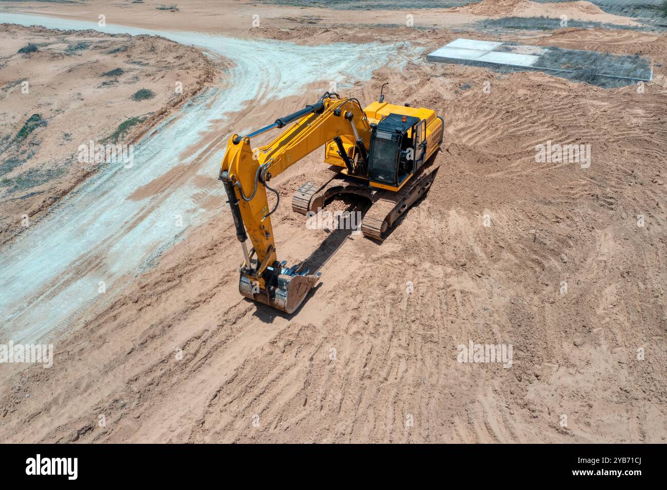 aerial view of excavator on the construction site digging Stock Photo ...