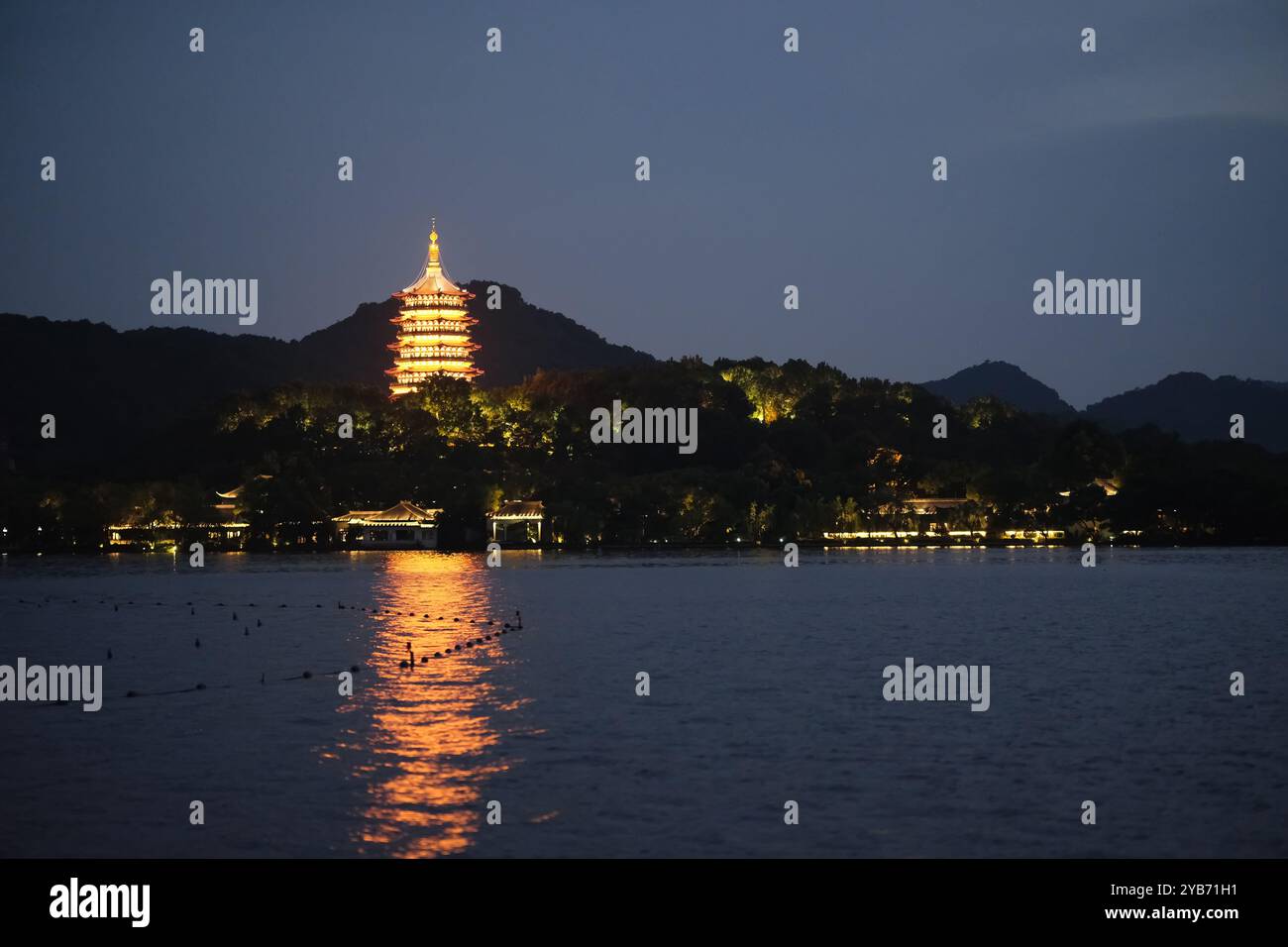 Leifeng Pagoda and west lake at night, in Hangzhou, Zhejiang, China ...