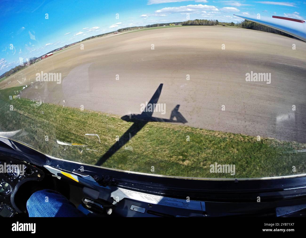 A glider is drawn up with a propeller plane on an airfield Stock Photo ...