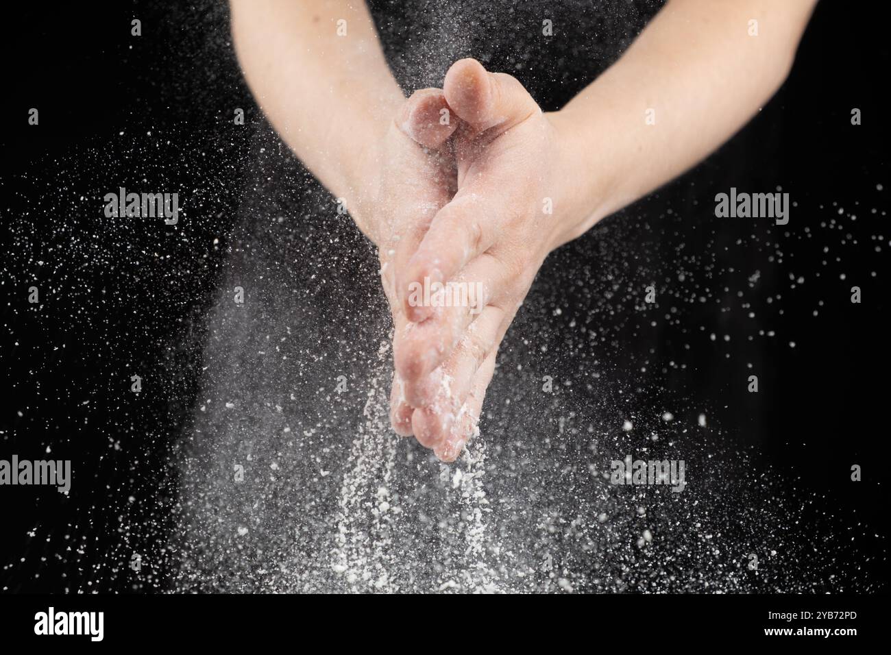 Splash of wheat flour, cook working with dough, hands close-up Stock ...