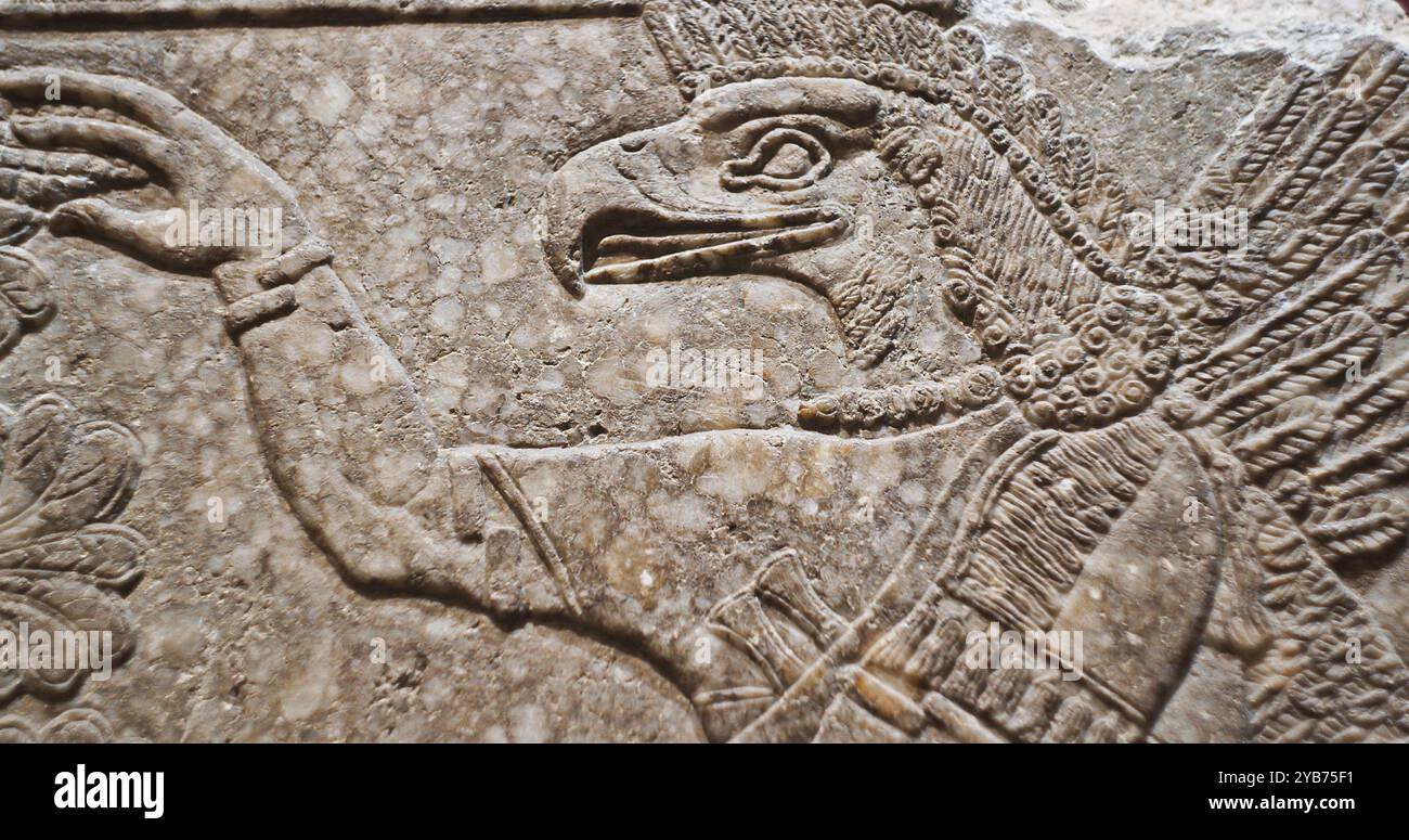 Close-up view on Eagle-headed Winged Figure And Sacred Trees ...