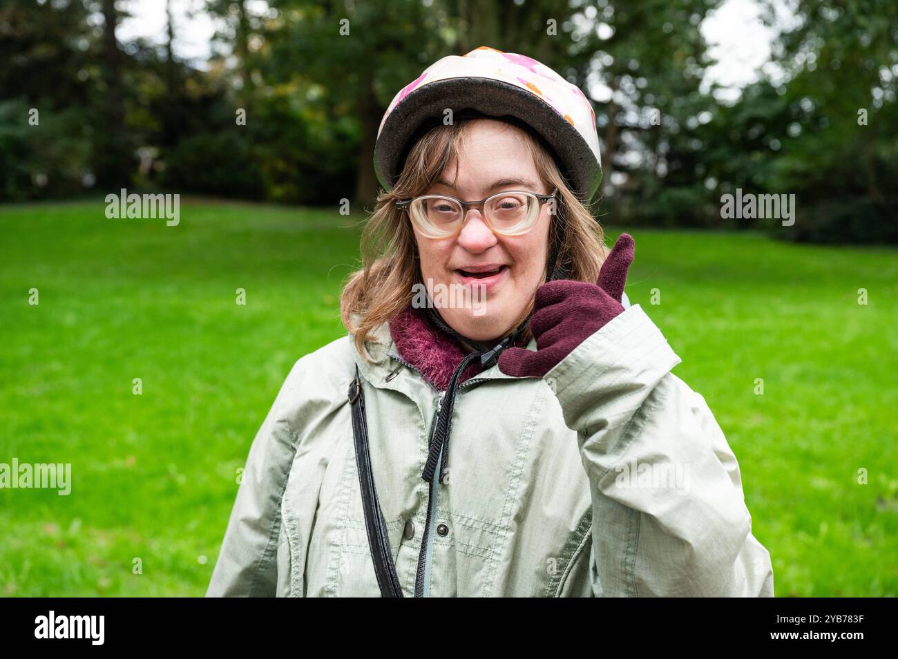 Outdoor portrait of a happy 42 yo woman with Down Syndrome, Tienen ...
