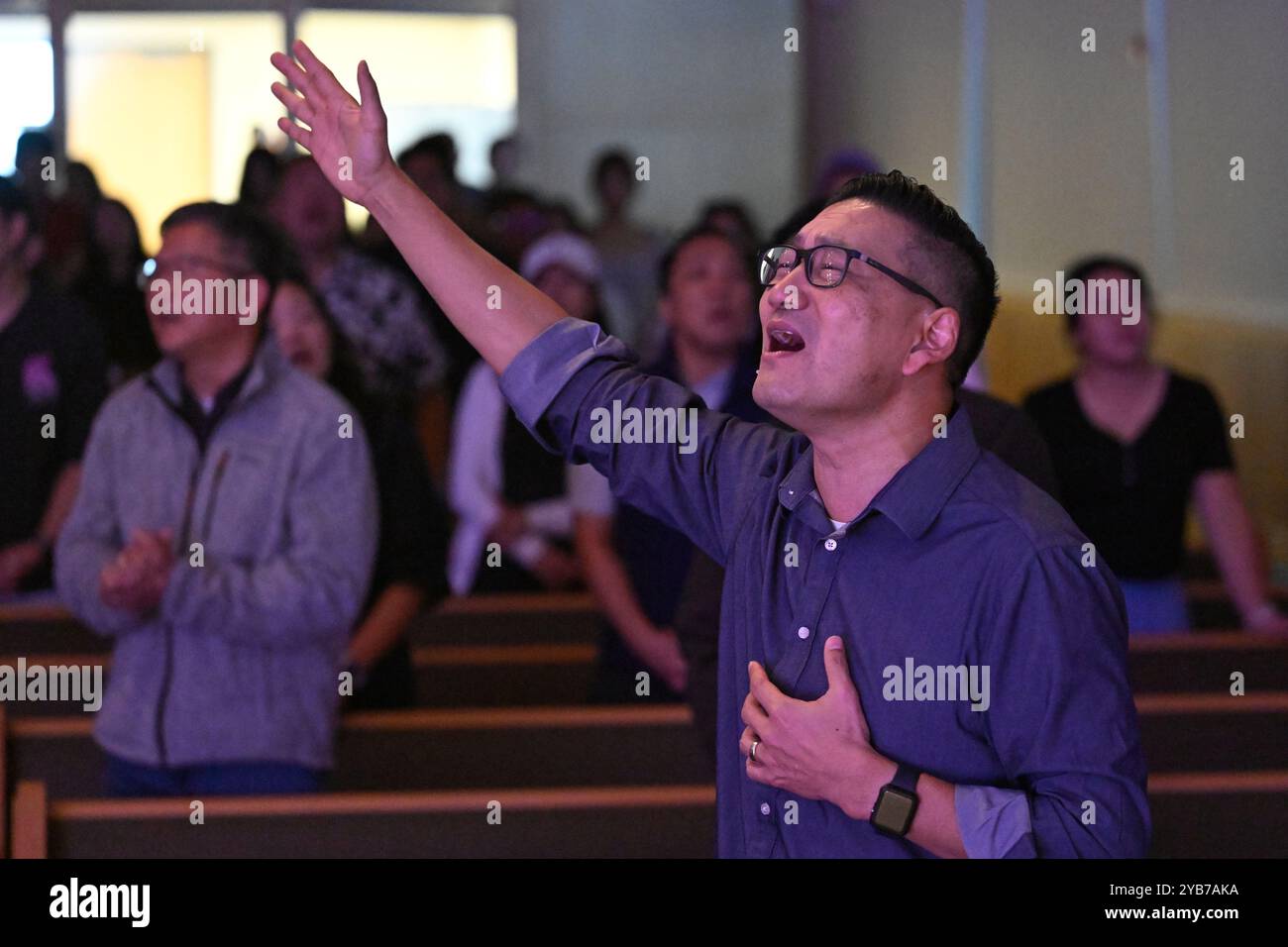 Pastor Owen Lee sings during a service at the Christ Central ...