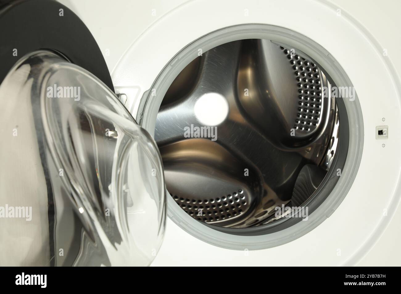 Washing machine with empty drum as background, closeup Stock Photo - Alamy
