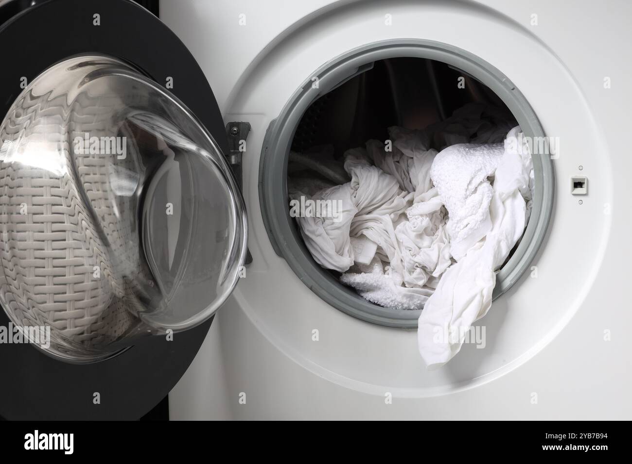 Open washing machine with clean clothes, closeup Stock Photo - Alamy