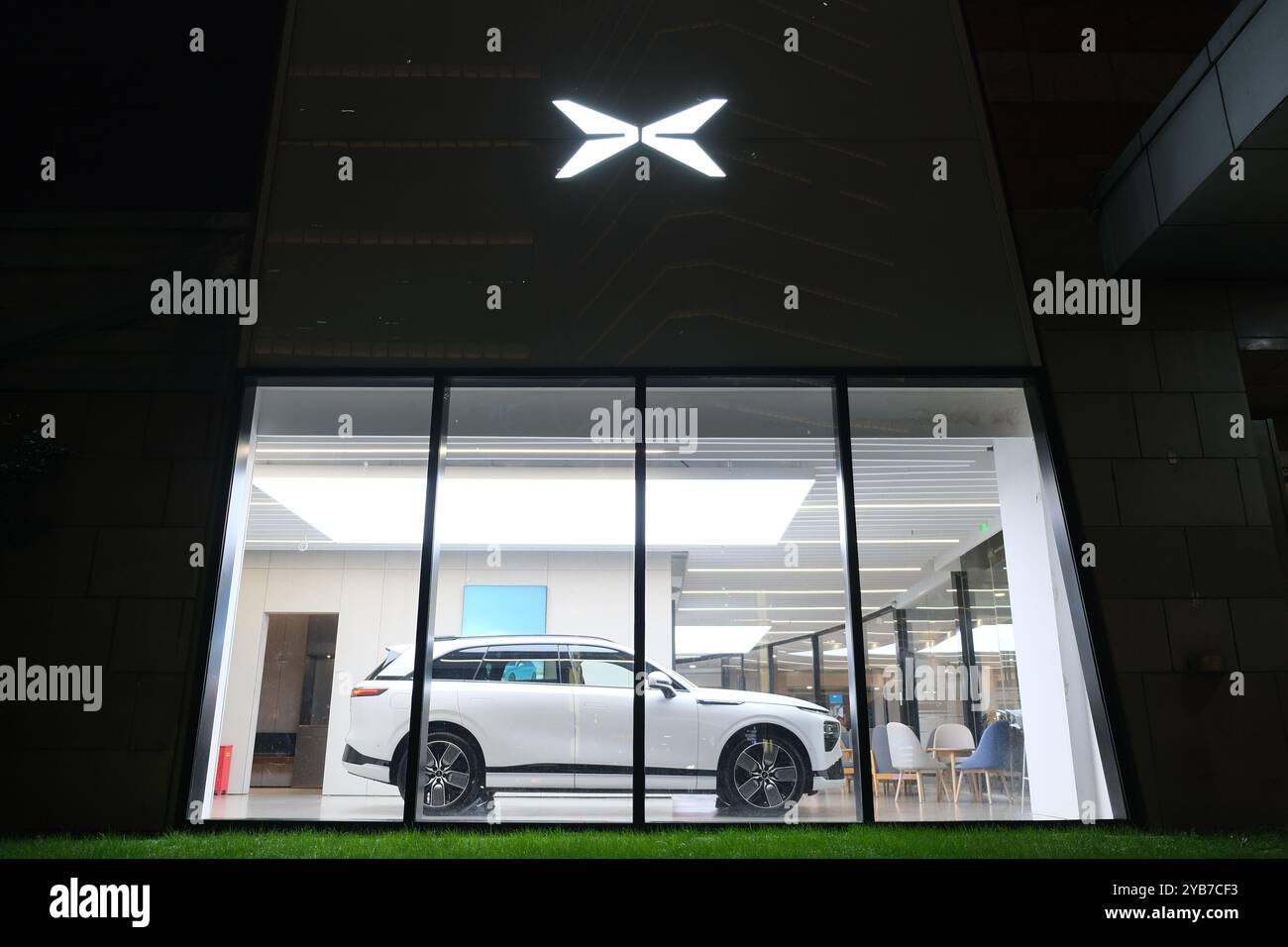 Shanghai,China-August 2nd 2023: Xpeng Motors electric car retail store and logo.Chinese EV brand ...