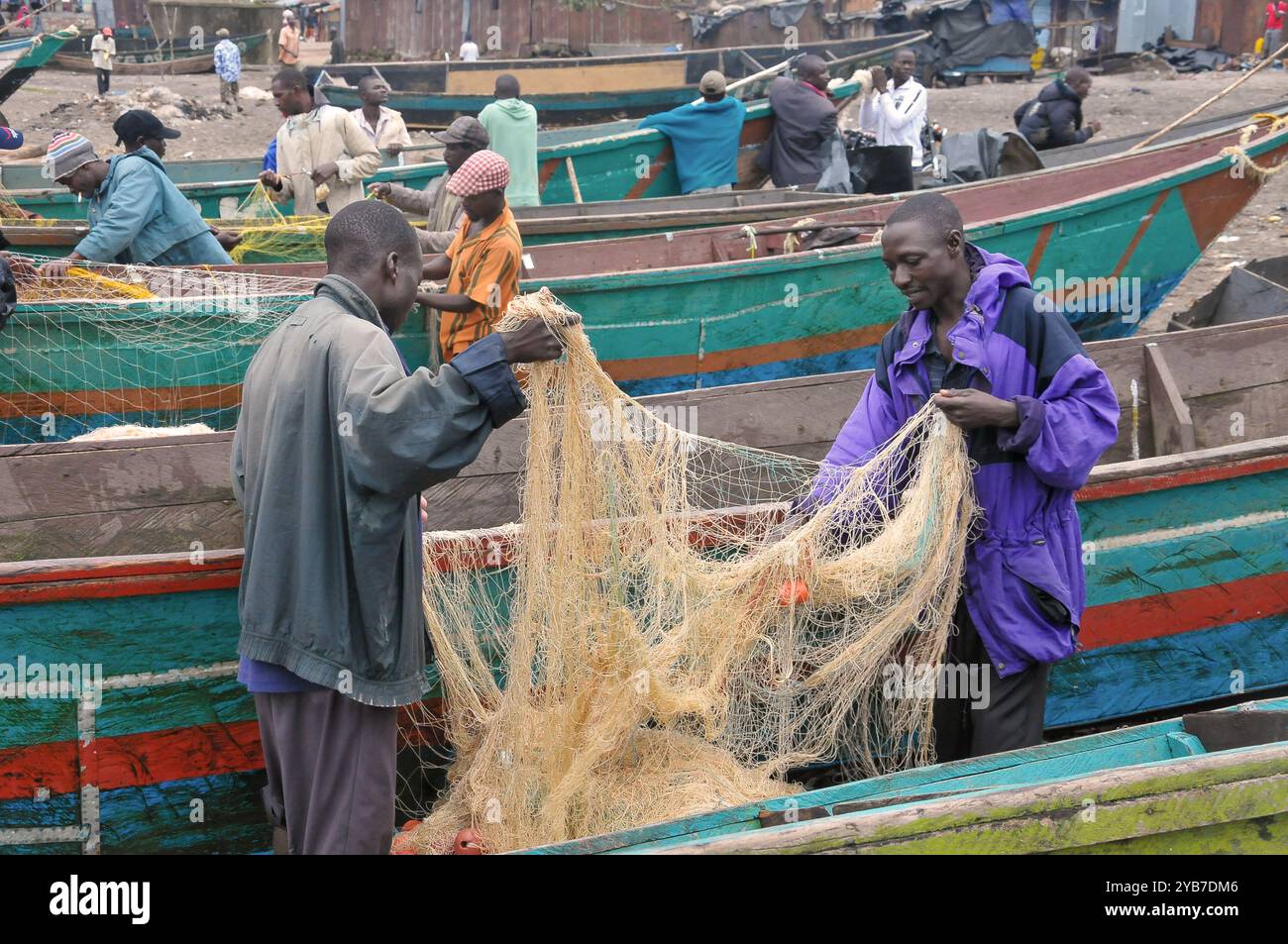 Fishermen sorting fishing nets at Kasensero fish landing site on Lake ...