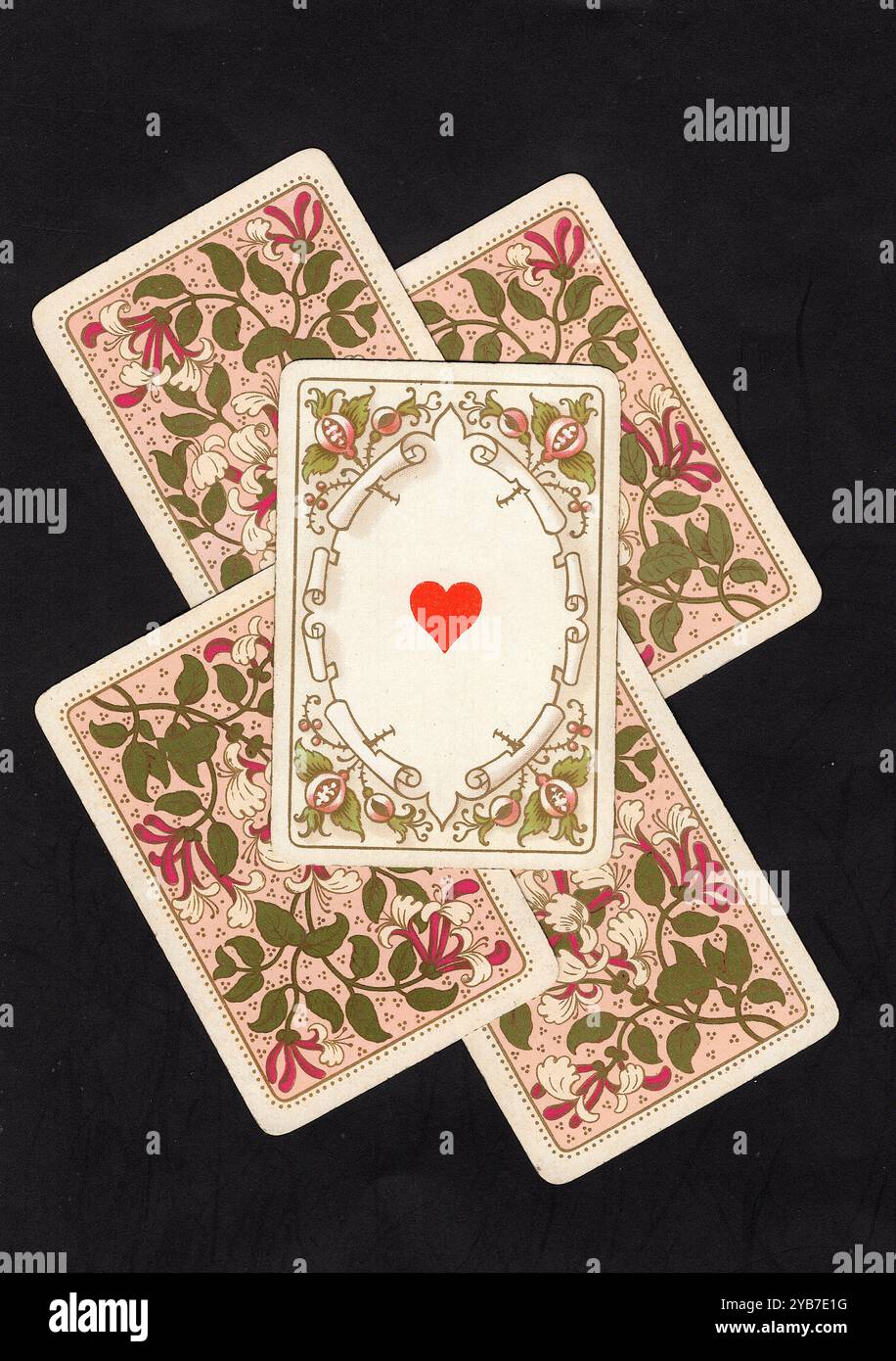 A montage of playing cards with one card revealed on a black background ...