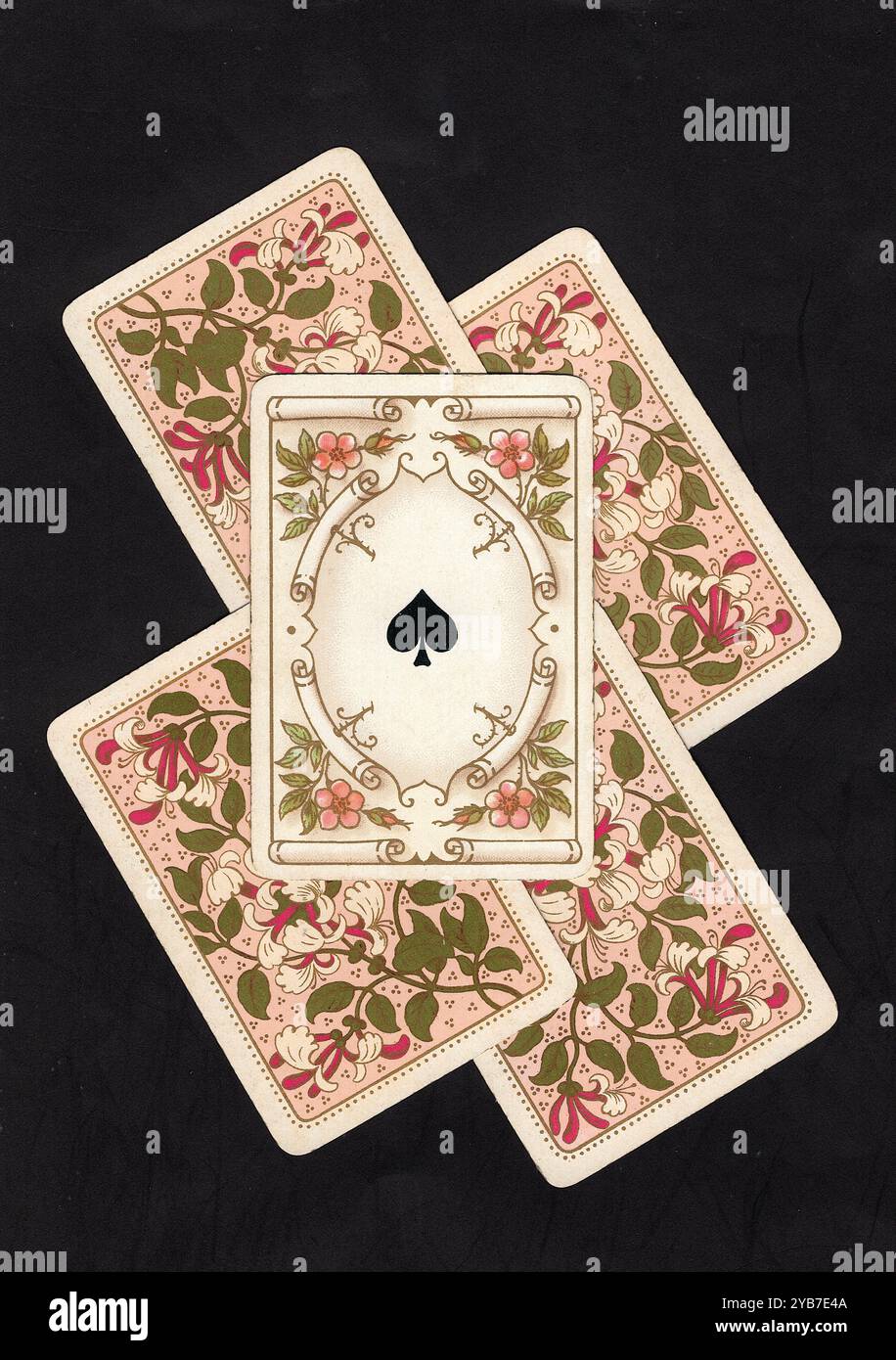 A montage of playing cards with one card revealed on a black background ...