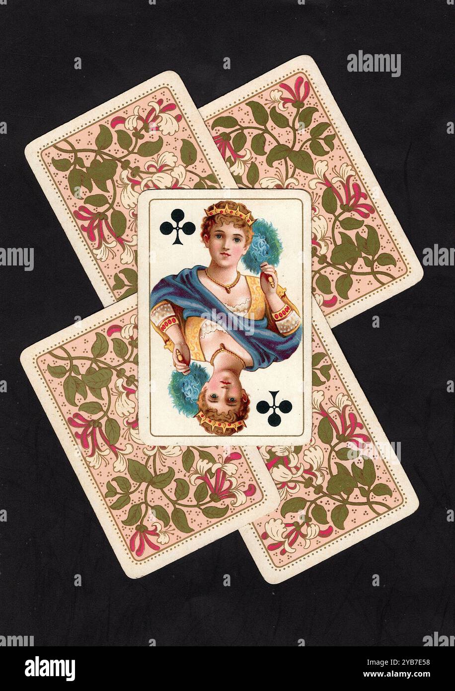 A montage of playing cards with one card revealed on a black background ...