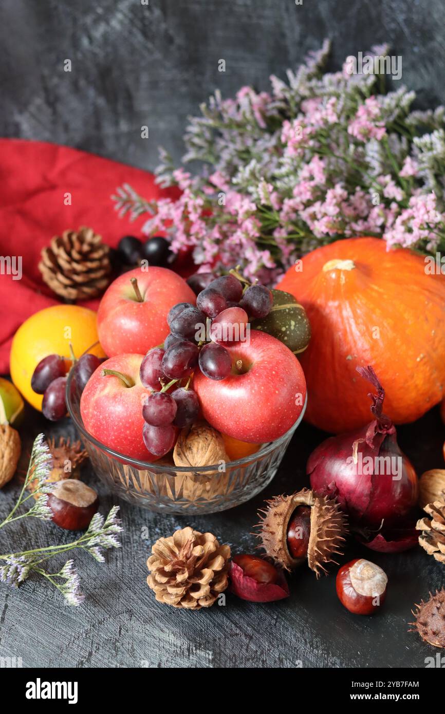 Colorful still life with seasonal fruit and vegetables on fark grey ...