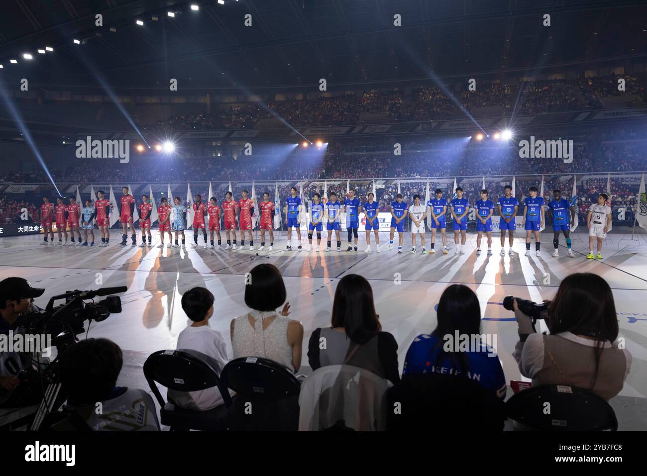 Players stand lined up after the opening match of Daido Life SV. League ...