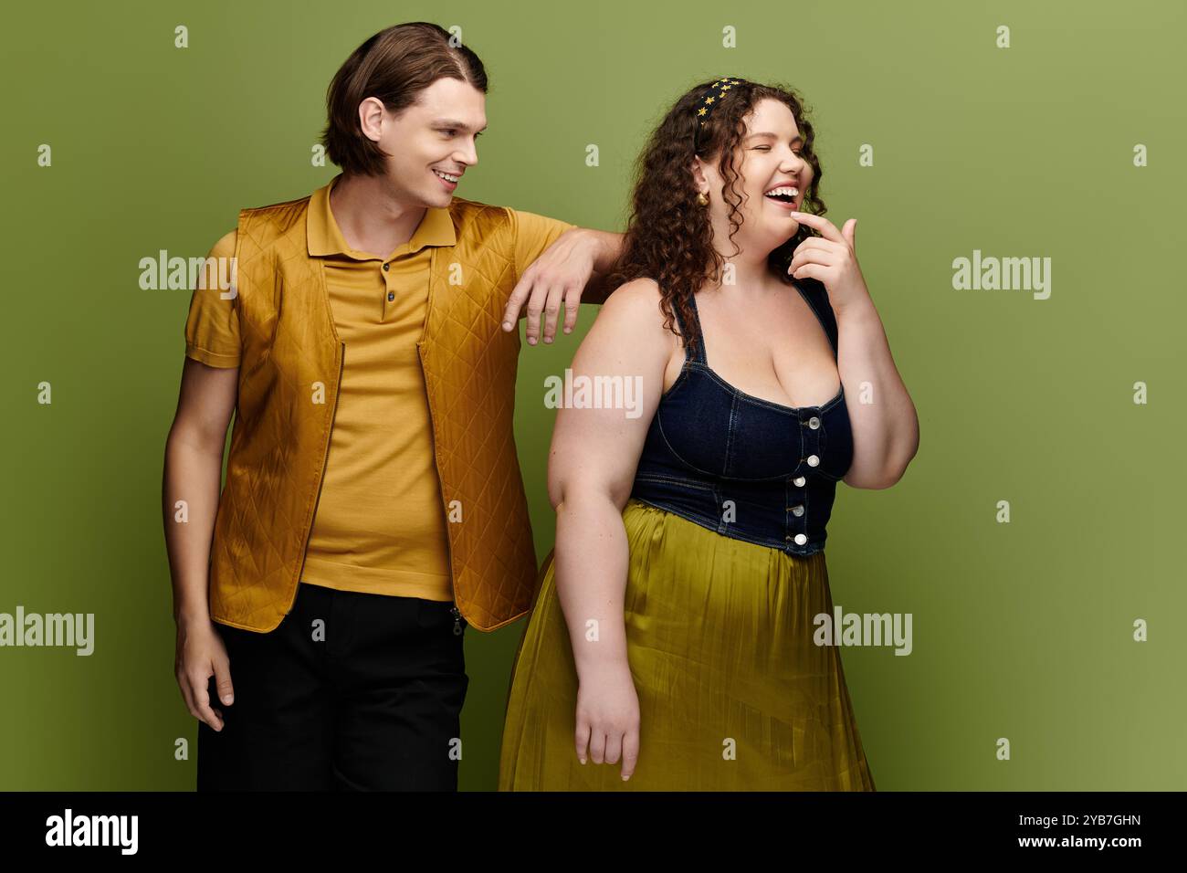 A cheerful plus size woman playfully interacts with her male friend ...