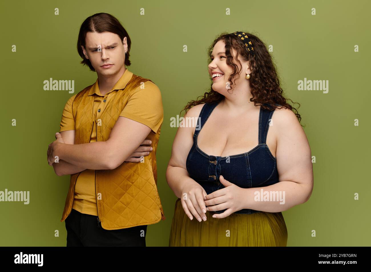 A cheerful young woman laughs with her skeptical friend, highlighting ...