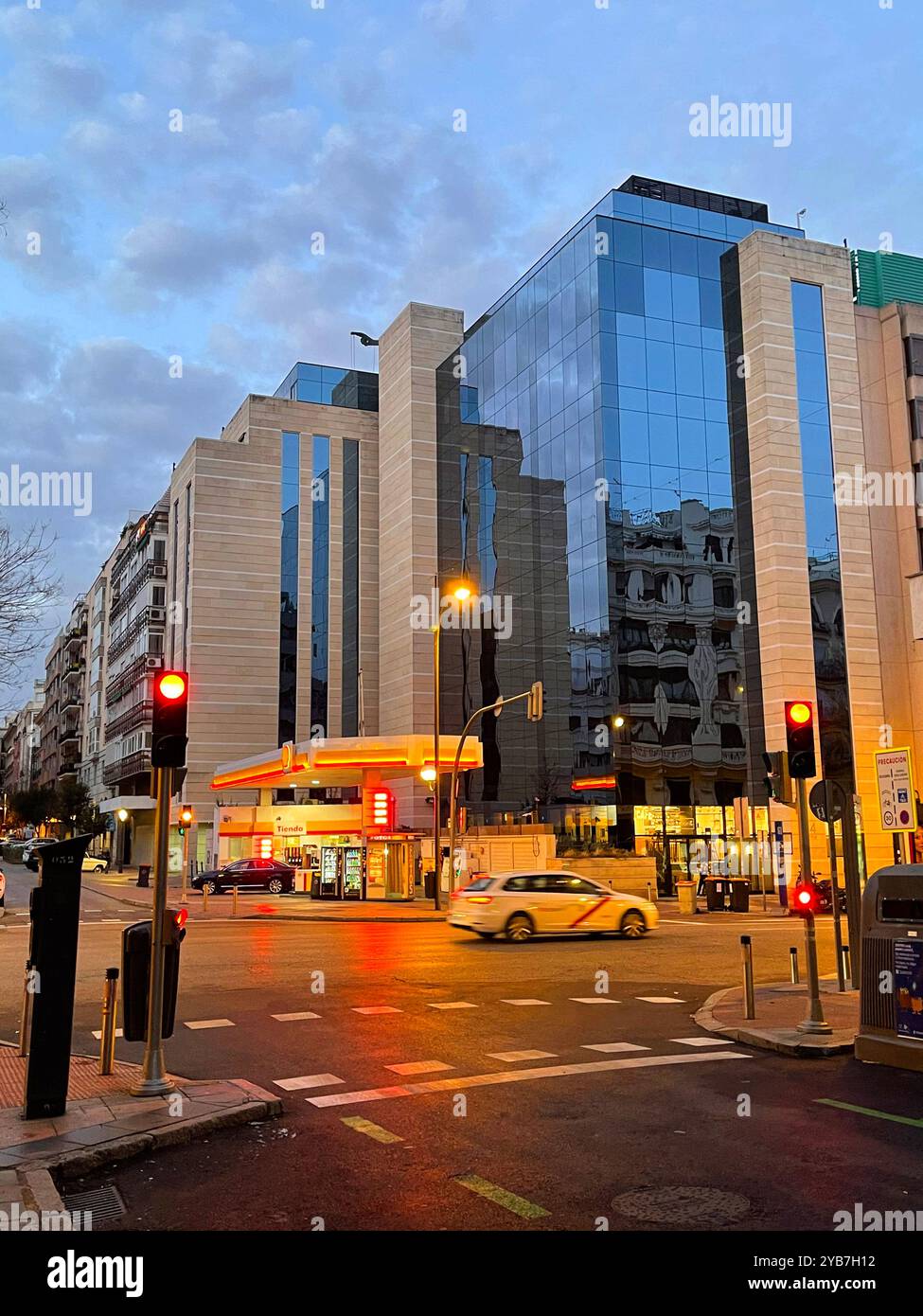 Petrol station and modern building, night view. Goya street, Madrid ...