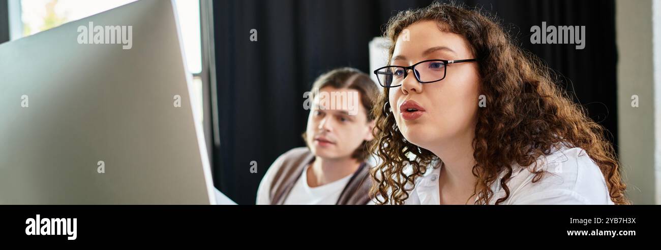 A young plus size woman eagerly shares ideas with her attentive male ...